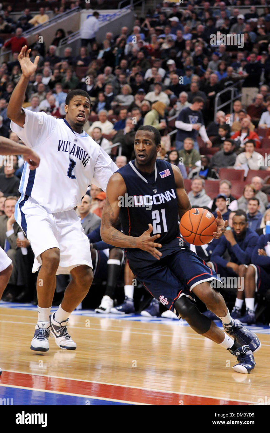 Connecticut forward Stanley Robinson #21 drives around Villanova ...