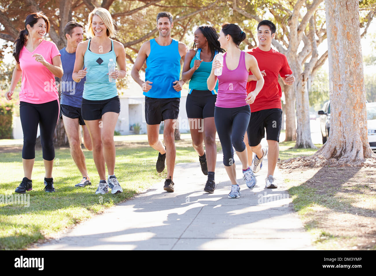 Group Of Runners On Suburban Street Stock Photo - Alamy
