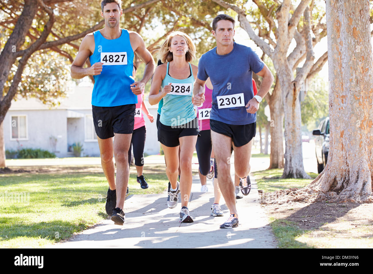 Group Of Runners On Suburban Street Stock Photo - Alamy