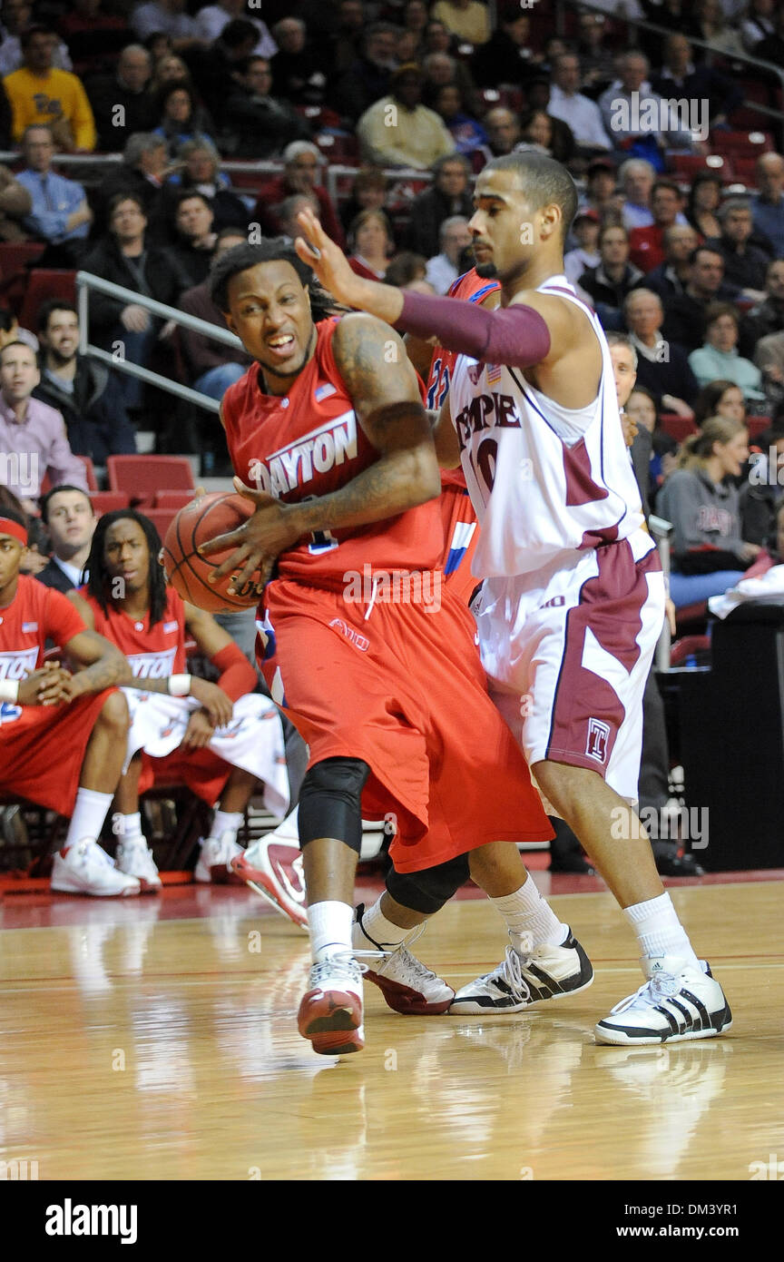 Dayton guard London Warren #1 is guarded by Temple guard Luis Guzman ...