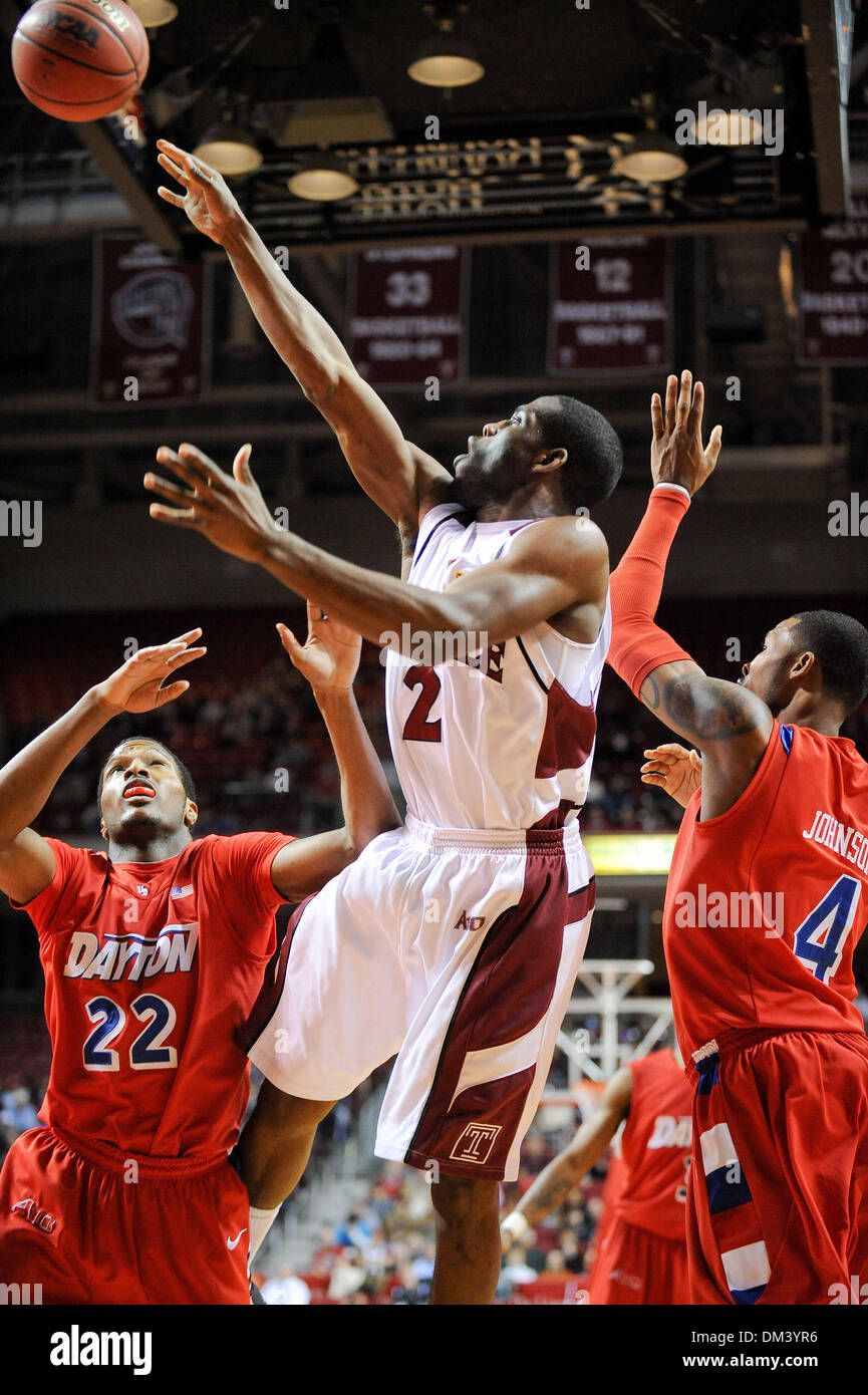 Temple guard Ryan Brooks #2 shoots over Dayton guard Paul Williams #22 ...