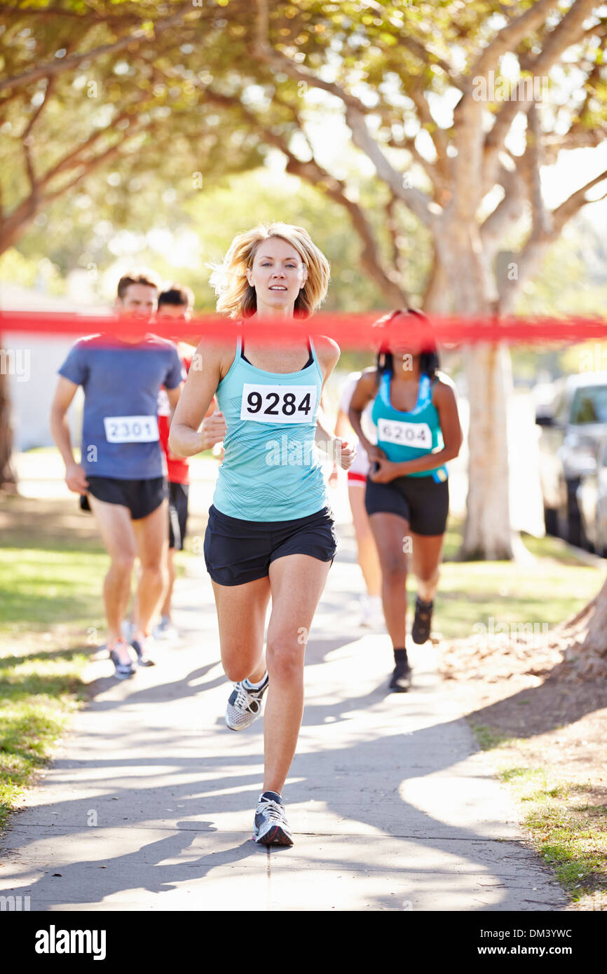 Female Runner Winning Marathon Stock Photo - Alamy