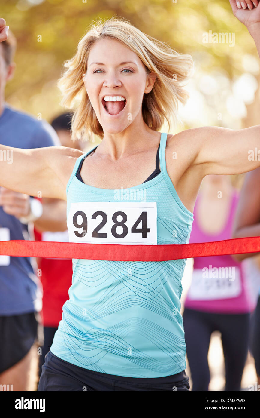 Female Runner Winning Marathon Stock Photo - Alamy