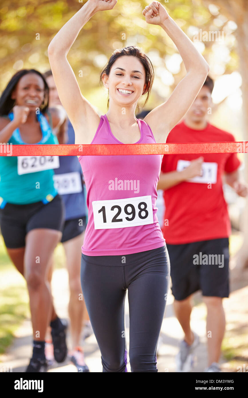 Female Runner Winning Marathon Stock Photo - Alamy