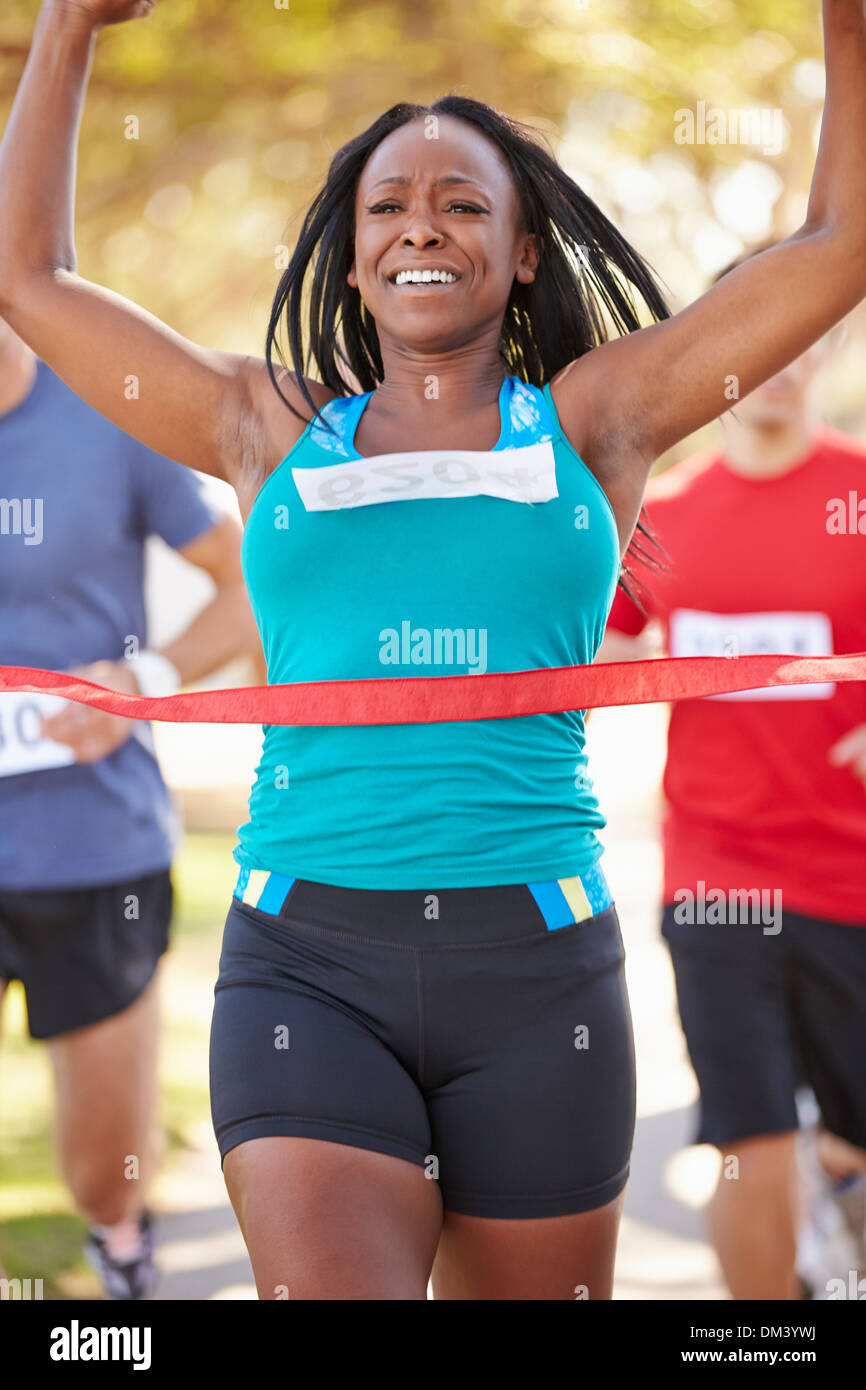 Female Runner Winning Marathon Stock Photo - Alamy