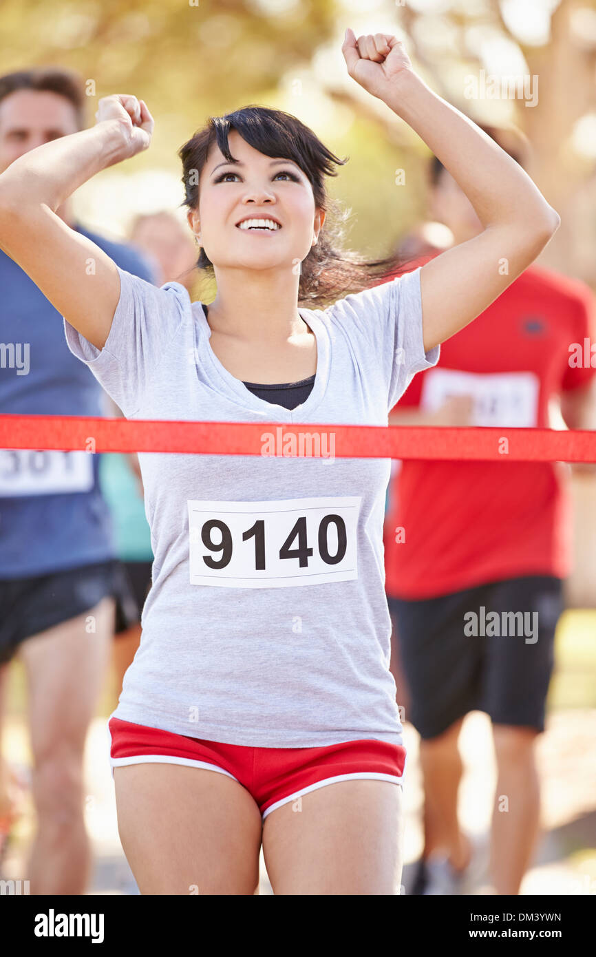 Female Runner Winning Marathon Stock Photo - Alamy