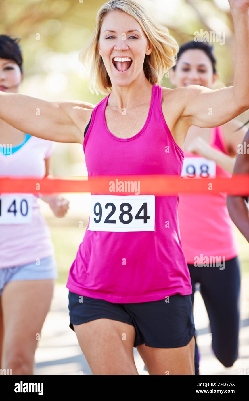 Female Runner Winning Marathon Stock Photo - Alamy