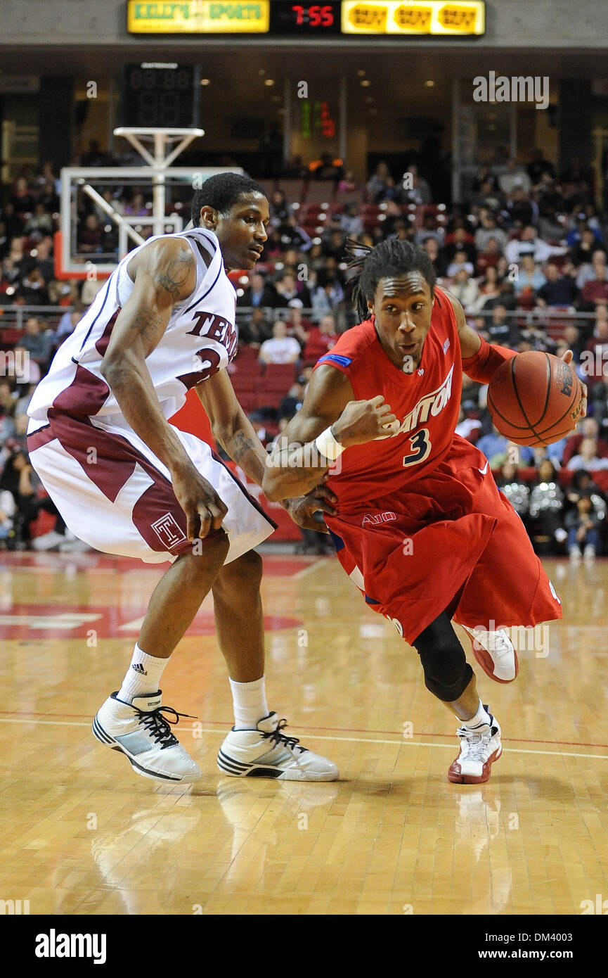 Dayton guard Rob Lowery #3 with the ball being guarded by Temple guard Ramone Moore #23. Temple ...