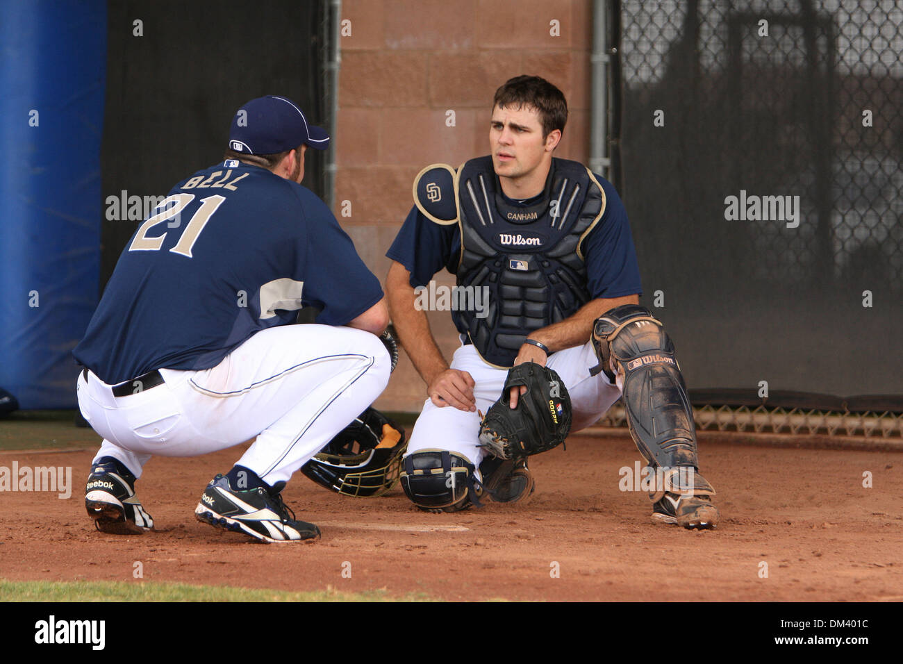 San Diego closer Heath Bell works with rookie catcher Mitch Canham who ...