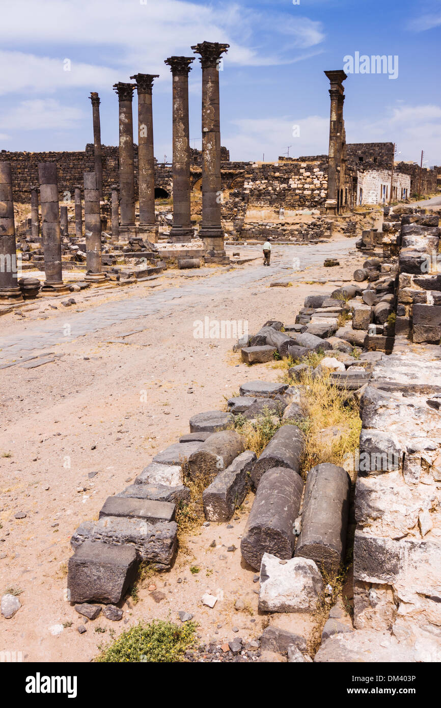 Decumanus avenue at the Roman ruins of ancient Bosra, Syria Stock Photo ...