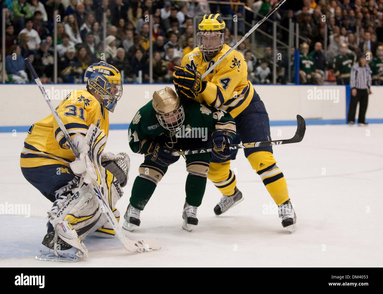 Michigan Goalie Shawn Hunwick (31), Defensemen Chris Summers (4) and ...