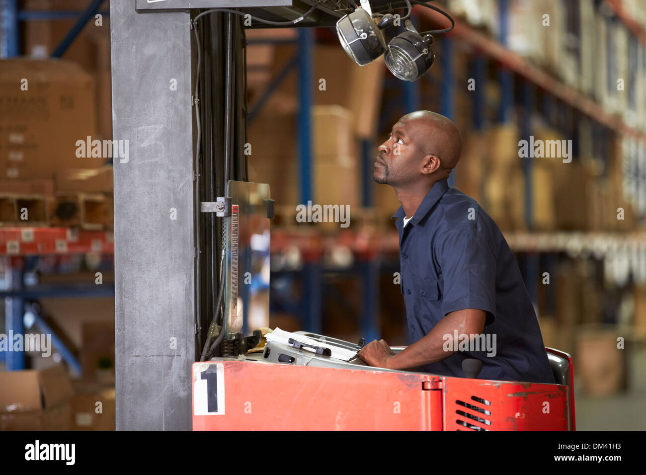 Warehouse worker pulling box forklift hi-res stock photography and ...