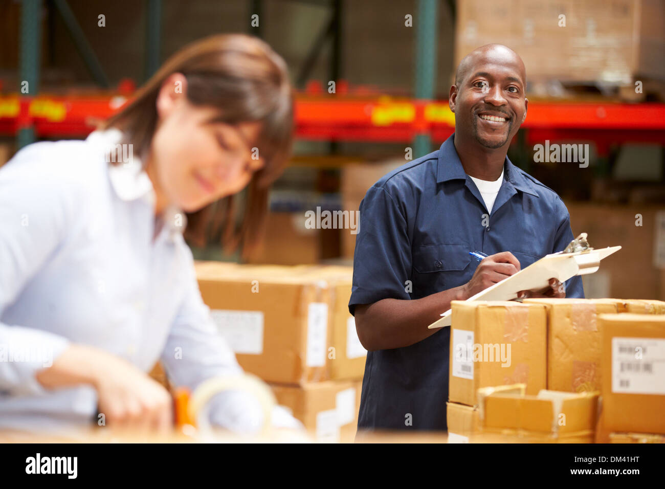 Workers In Warehouse Preparing Goods For Dispatch Stock Photo - Alamy