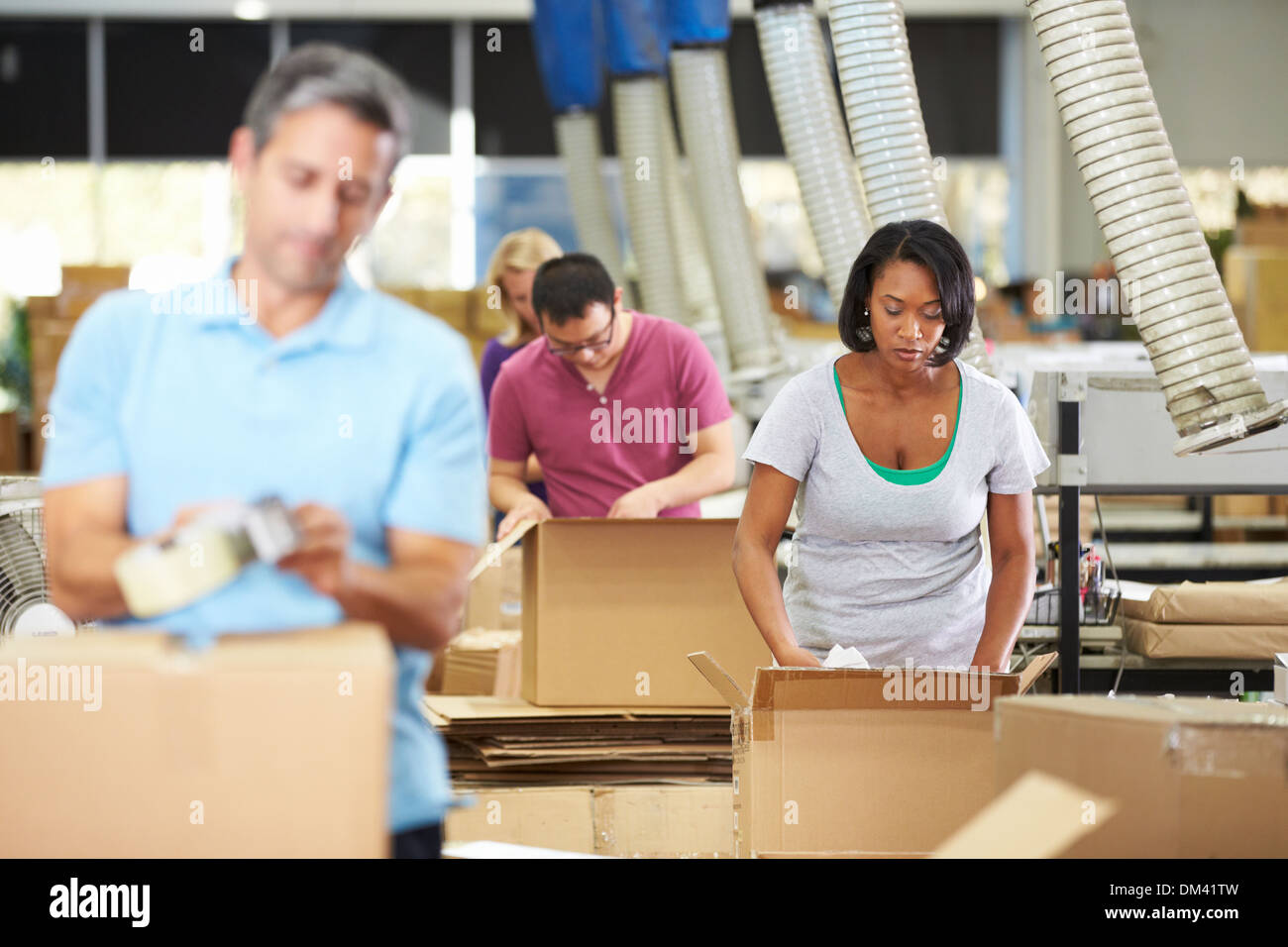 Workers In Warehouse Preparing Goods For Dispatch Stock Photo - Alamy