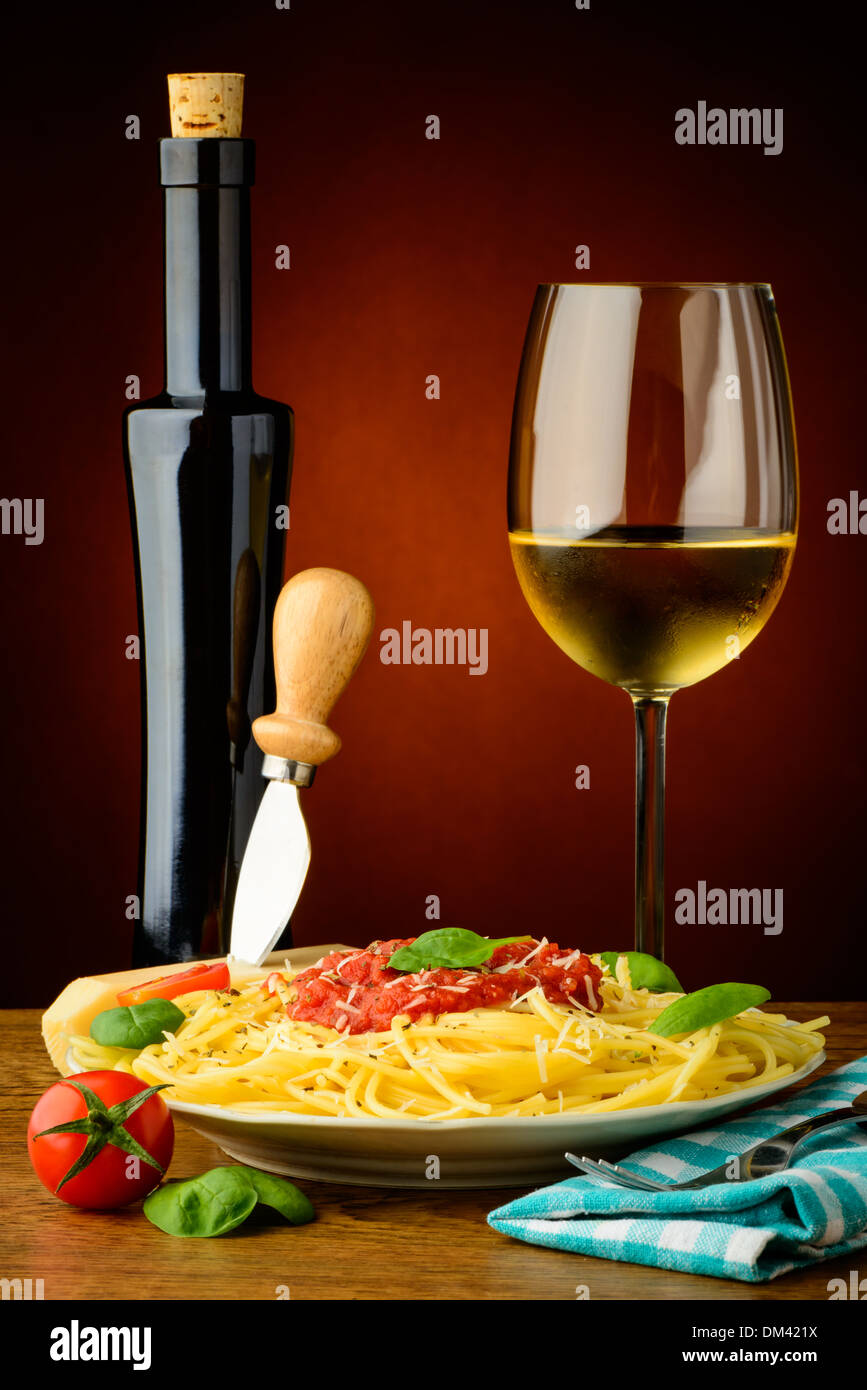 still life with traditional spaghetti pasta and white wine Stock Photo ...