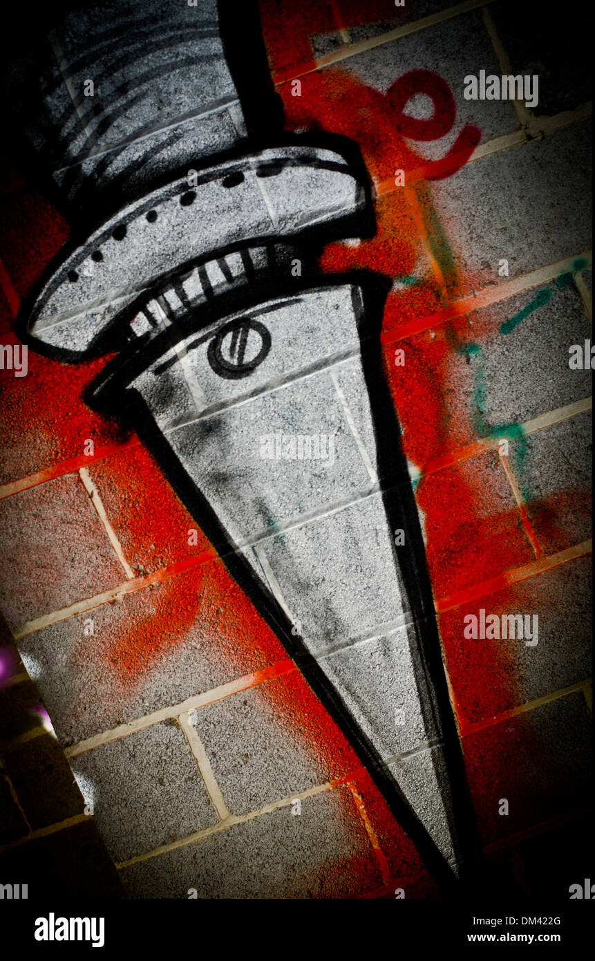 Dagger Graffiti on wall Stock Photo - Alamy