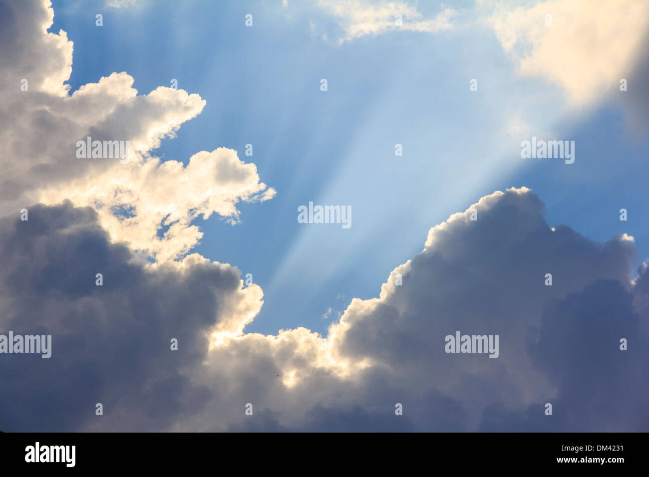 Rays of light shining through white clouds Stock Photo - Alamy