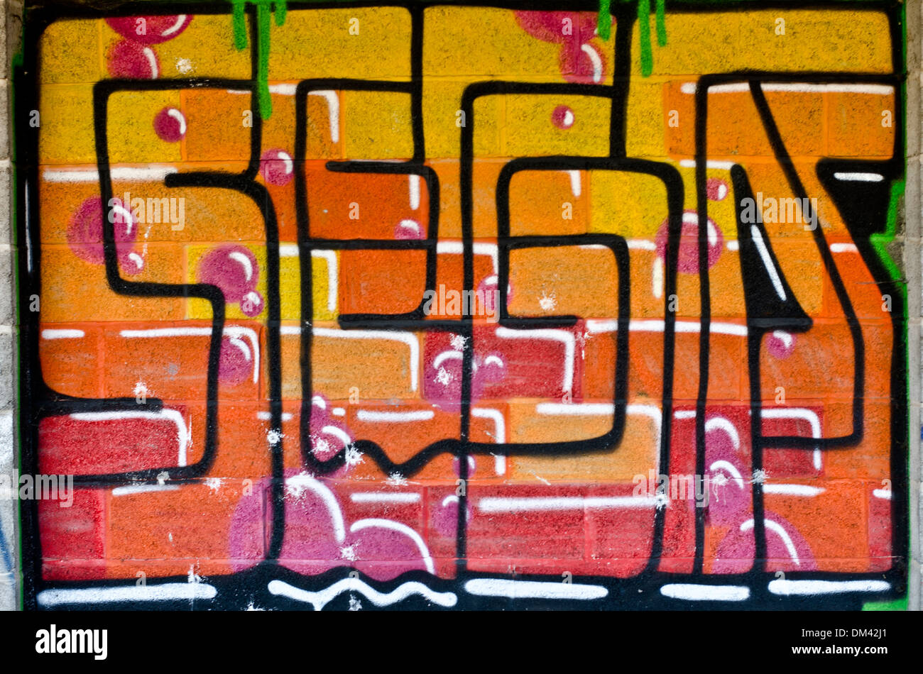 Orange Graffiti artwork Stock Photo - Alamy