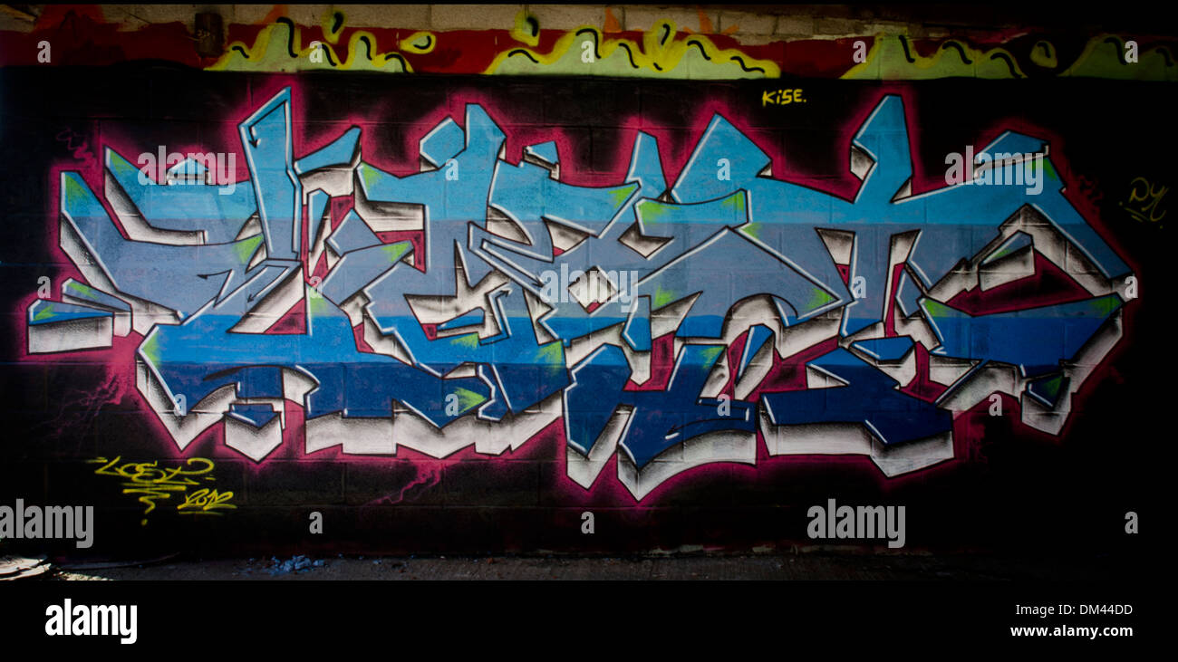 Blue Graffiti on wall, tagged, logo, art Stock Photo - Alamy