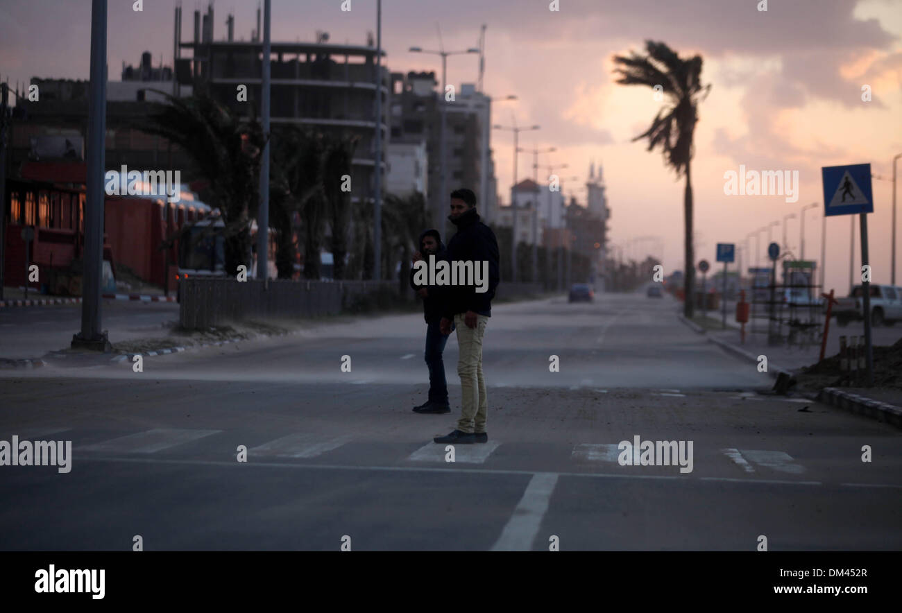 Gaza, Palestinian Territories. 11th Dec, 2013. Men walk on the beach in ...