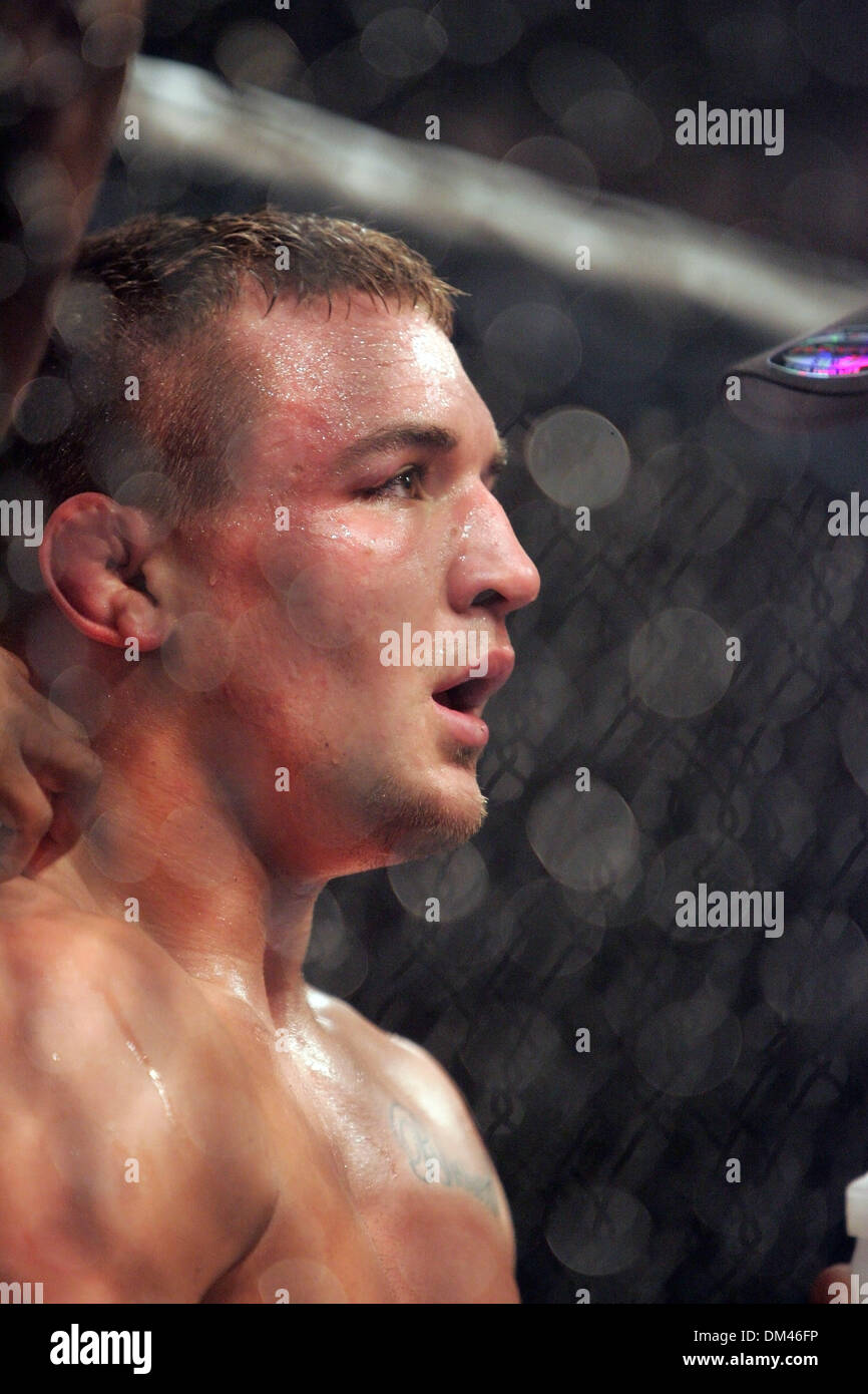 Mike Chandler, St. Louis, MO rests after the first round during his ...