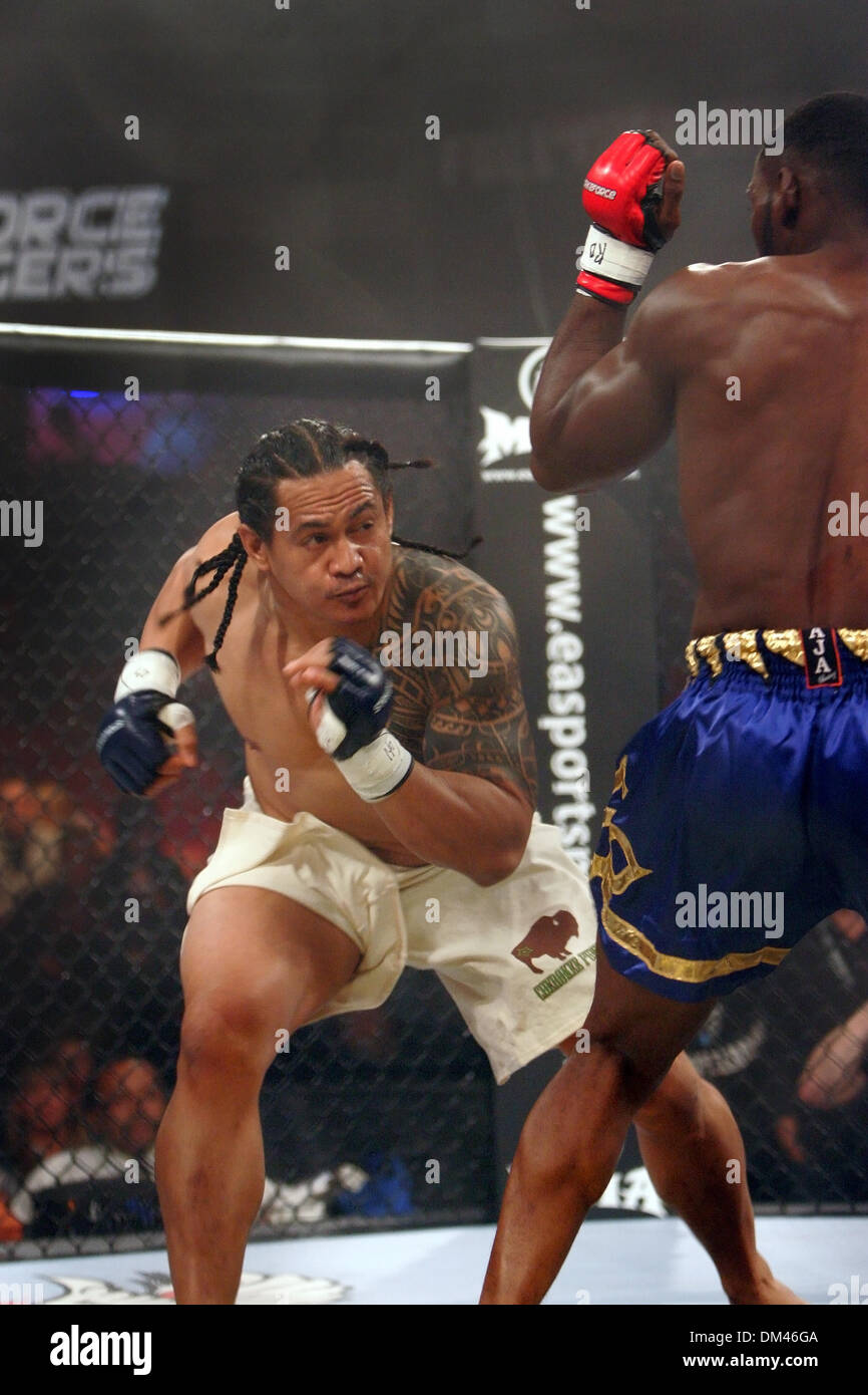 Gary Tapasua, Independence, MO (blue gloves) ducks a punch by Darryl ...