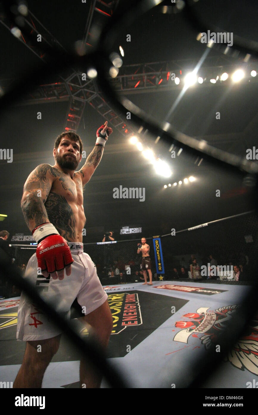 Lee Gibson, Kansas City, MO (red gloves) enters the cage before his ...