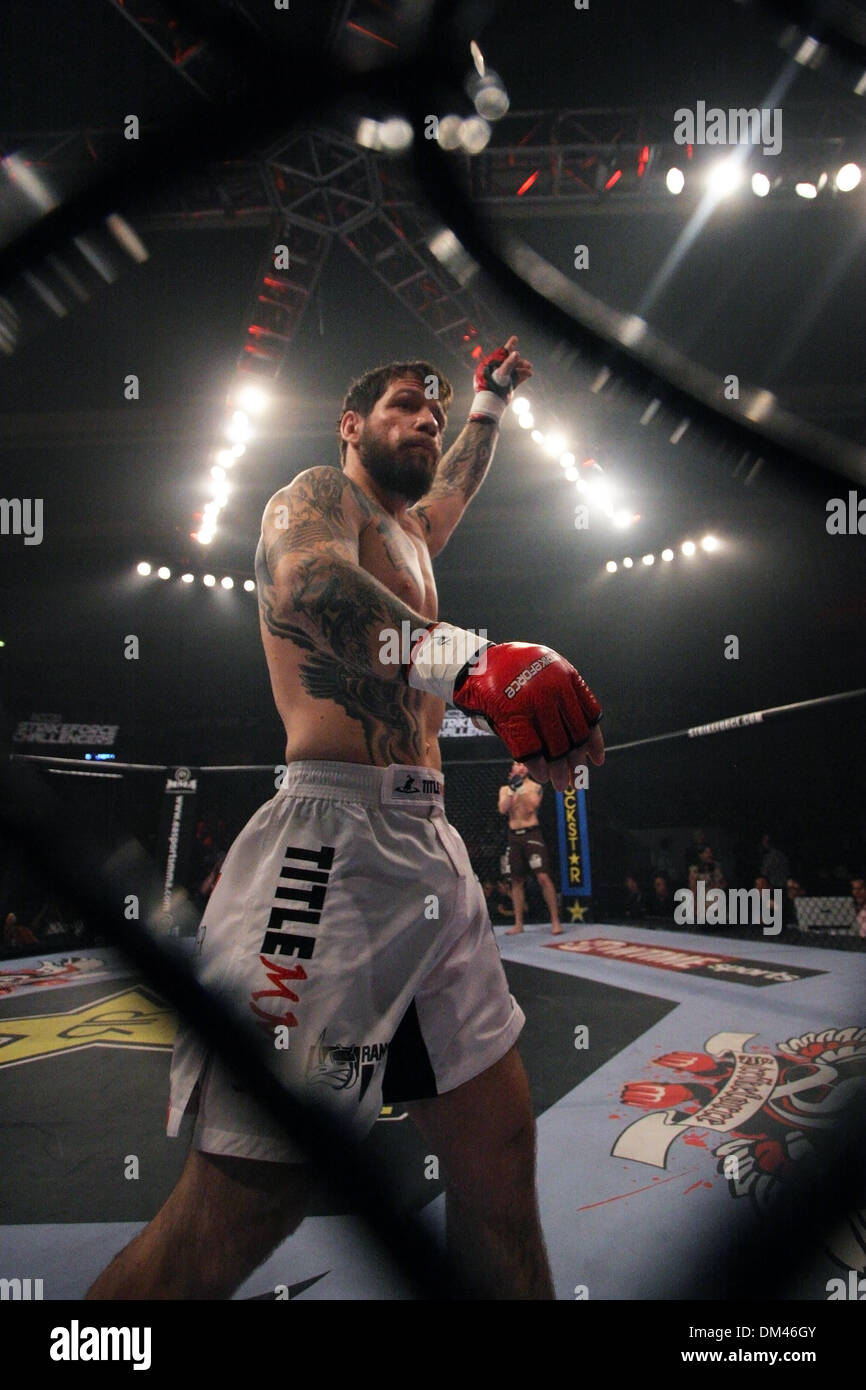 Lee Gibson, Kansas City, MO (red gloves) enters the cage before his ...