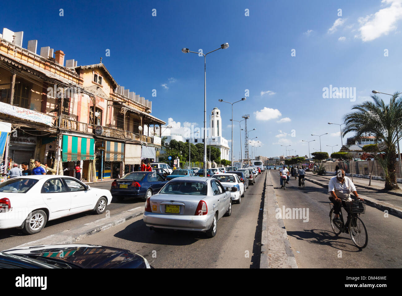 Cars queuing to board the free ferry on the Suez Canal linking Port ...