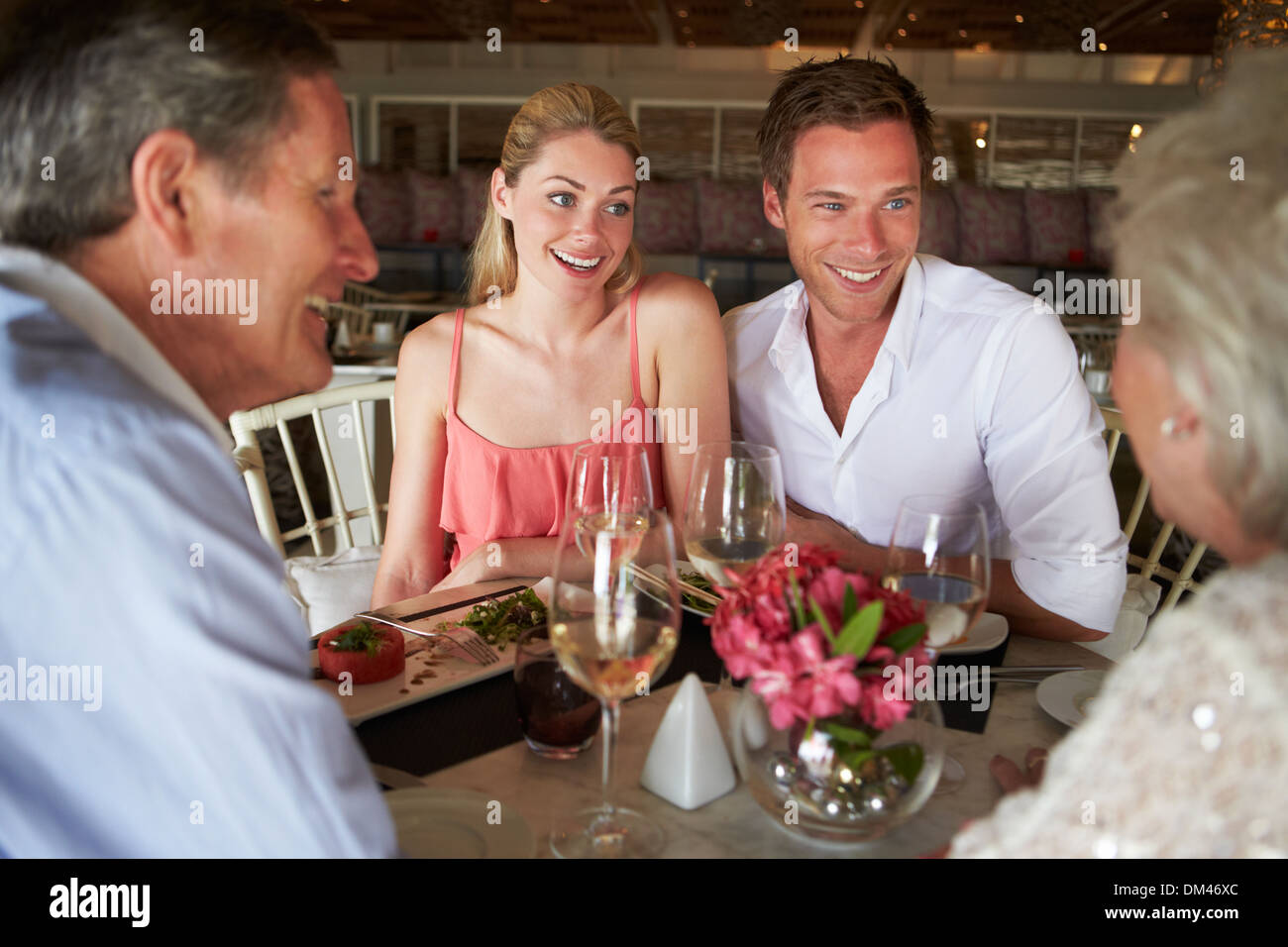 Group Of Friends Enjoying Meal In Restaurant Stock Photo - Alamy