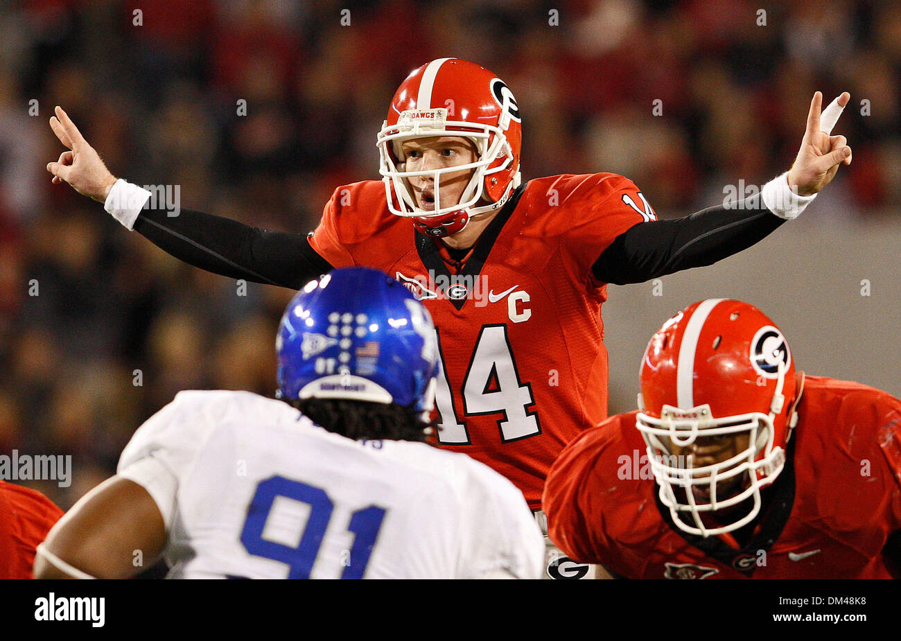 Georgia quarterback Joe Cox (14) calls an audible at the game against ...