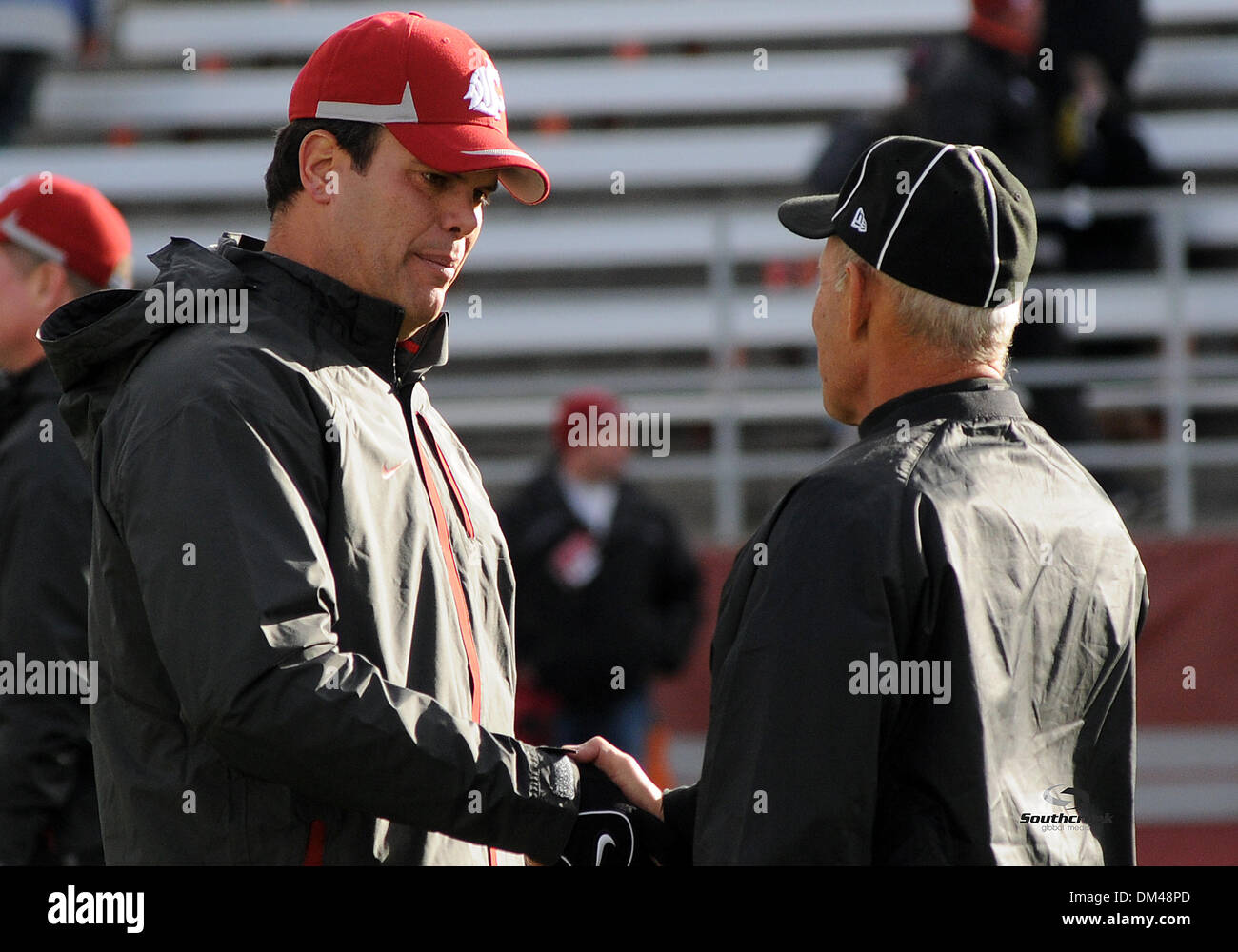 Washington State head coach Paul Wulff talks with a referee before a ...