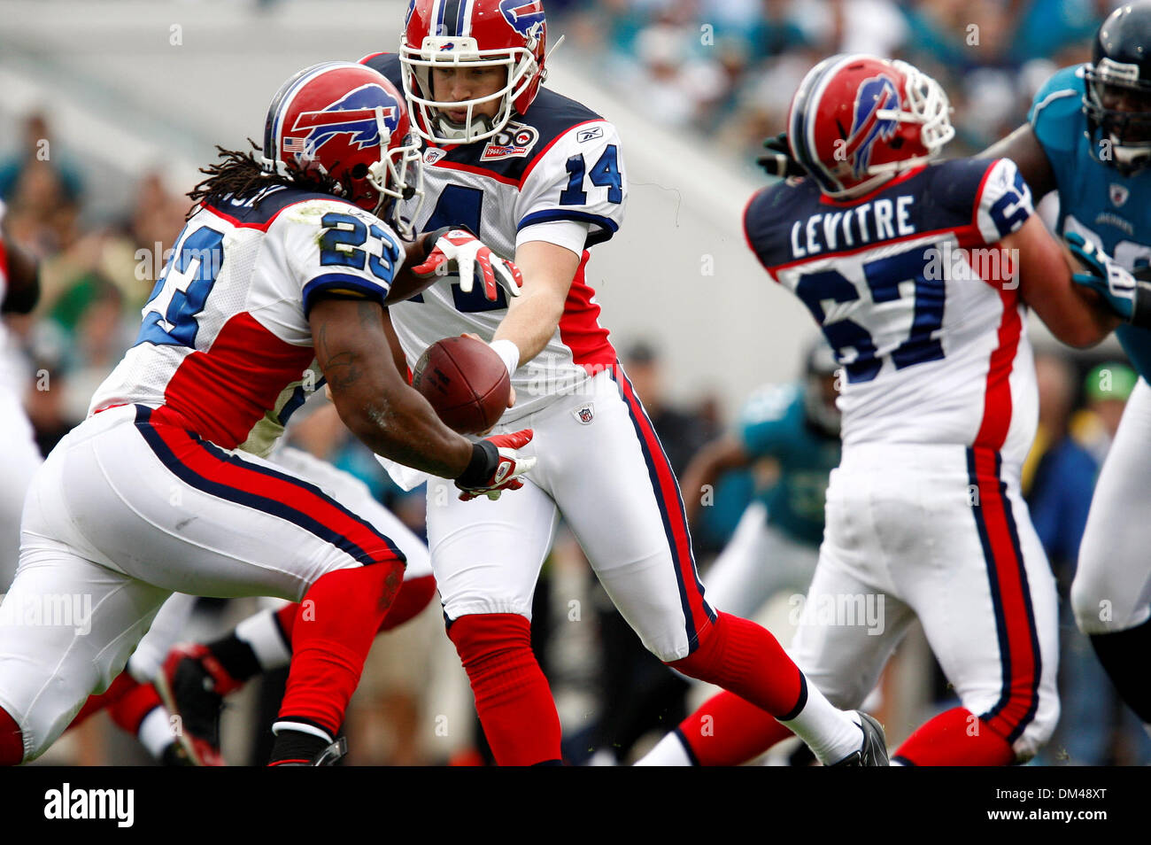 Buffalo Bills Ryan Fitzpatrick (14) hands off to Marshawn Lynch (23) in ...