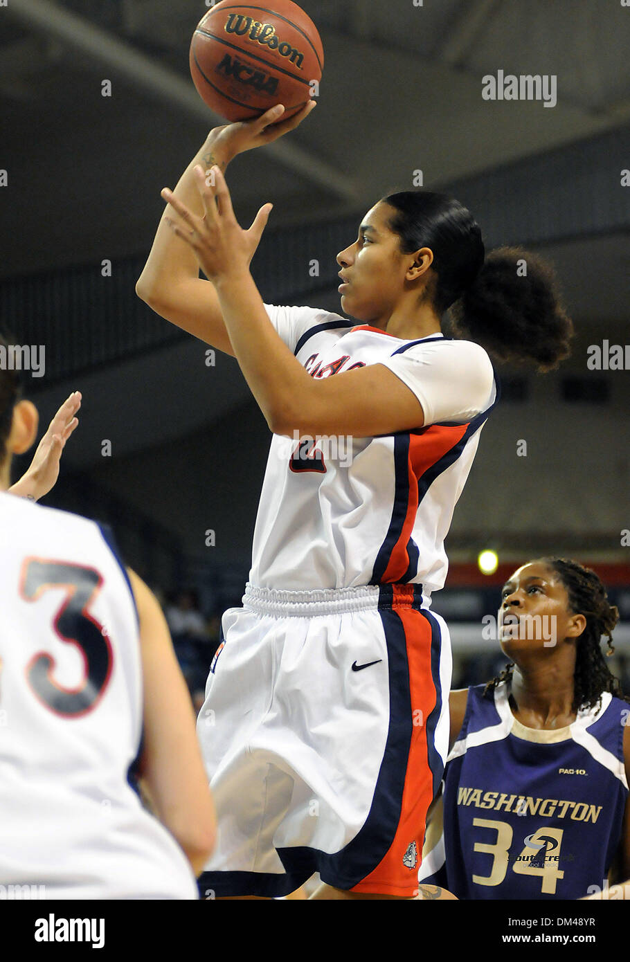 Gonzaga's forward Vivian Frieson, left, gets by Washington's Mollie ...