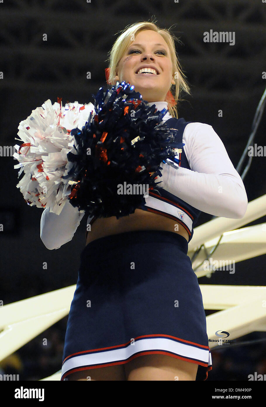 A member of the Gonzaga cheer squad tries to get the crowd fired up ...
