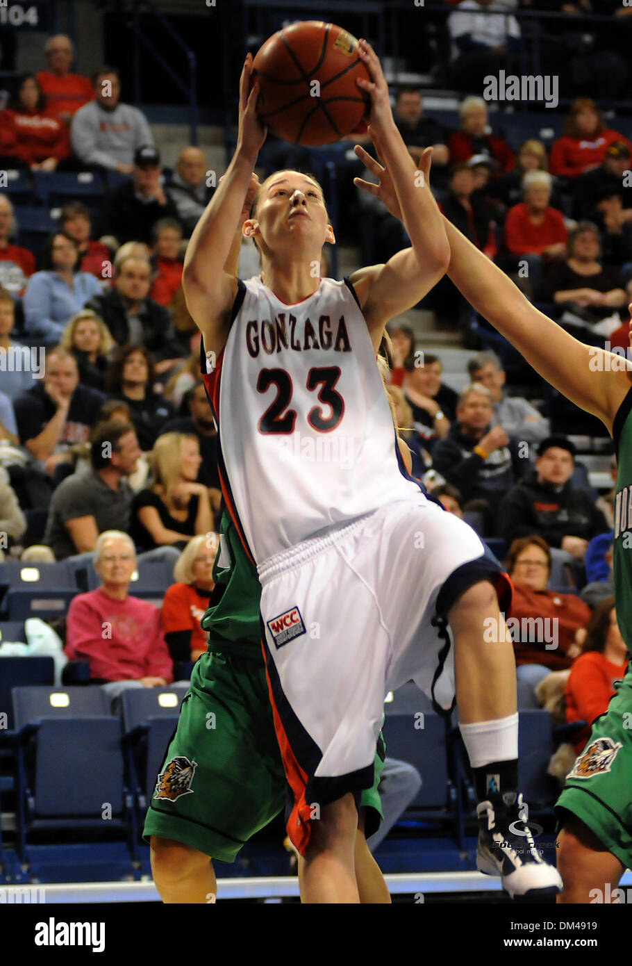 Gonzaga's guard Katelan Redmon (23) drives the baseline foe basket ...