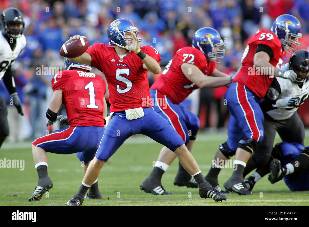 Kansas quarterback Todd Reesing (5) passes during game action between ...