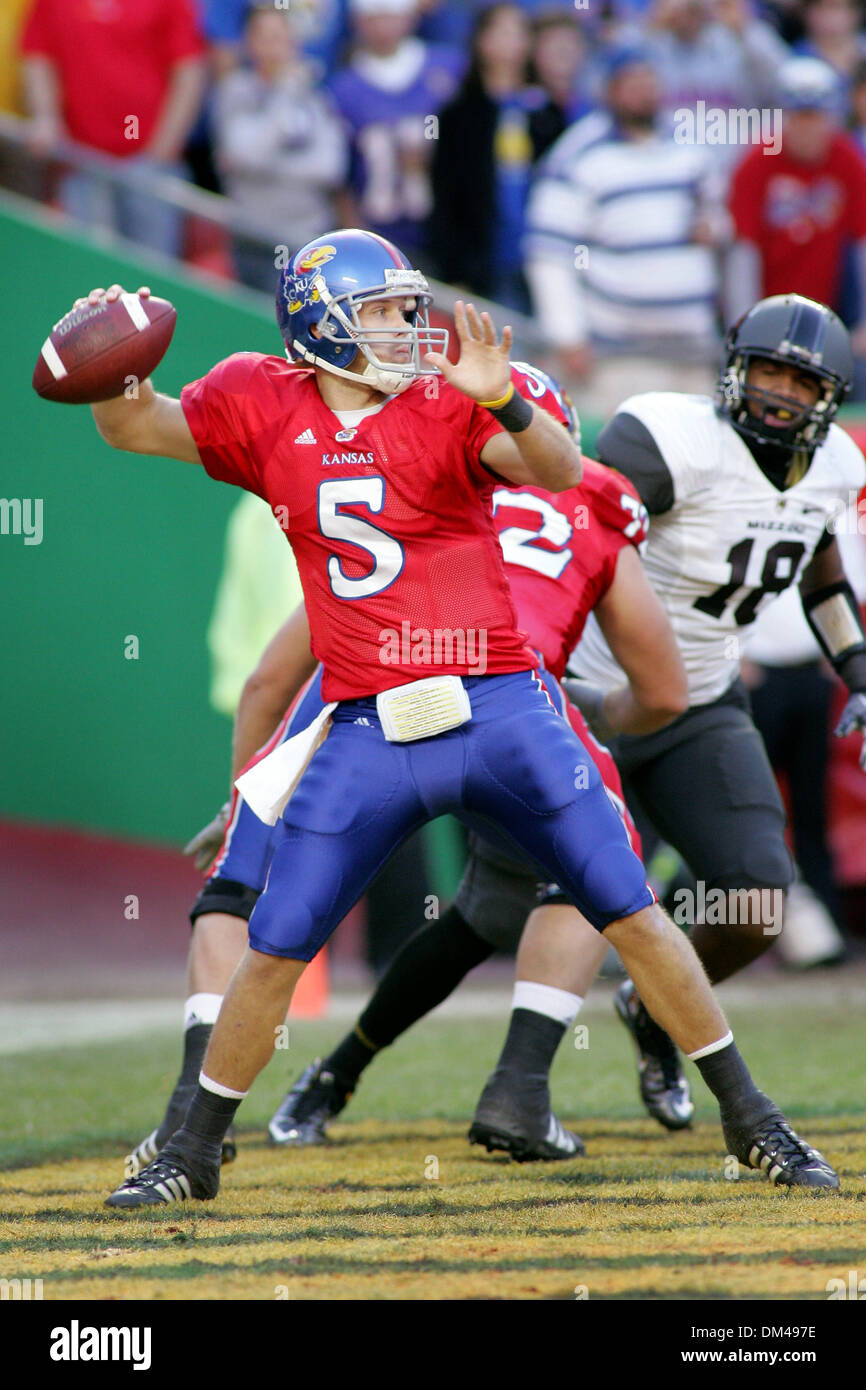 Kansas quarterback Todd Reesing (5) passes under pressure during game ...