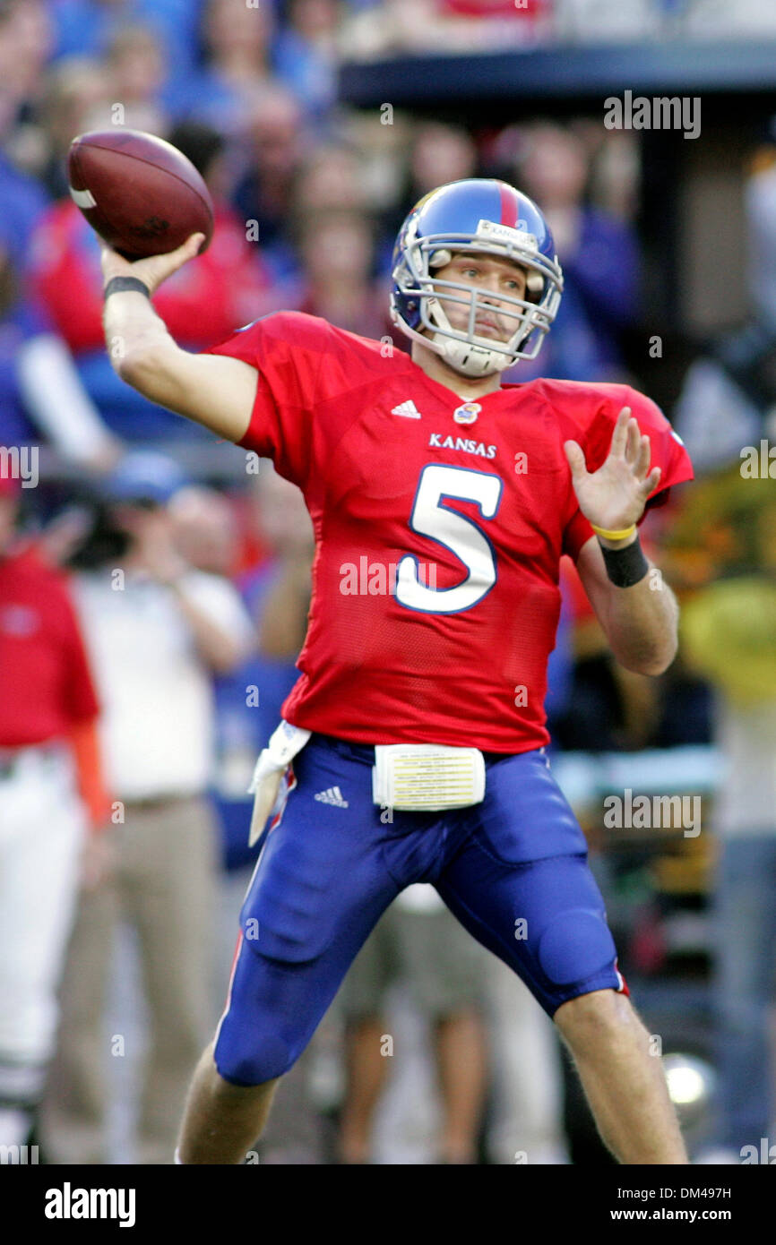 Kansas quarterback Todd Reesing (5) passes under pressure during game ...