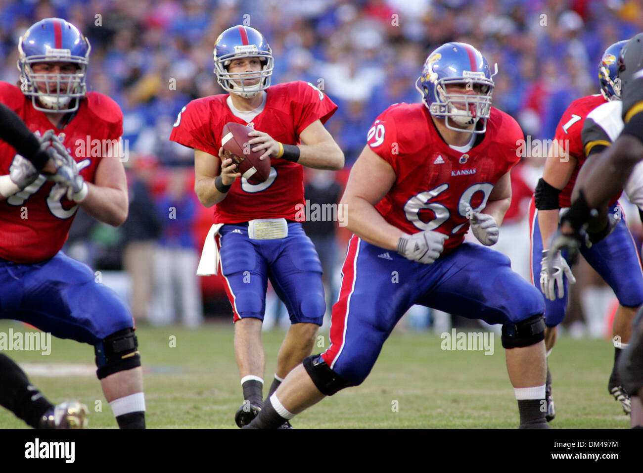 Kansas quarterback Todd Reesing (5) takes the snap during game action ...