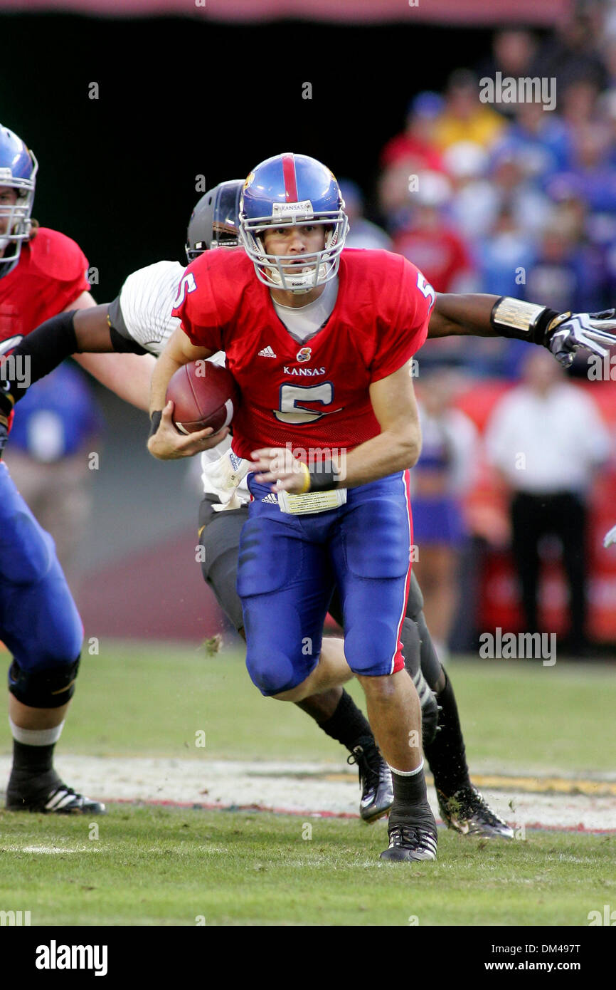 Kansas quarterback Todd Reesing (5) scrambles for yardage during game ...