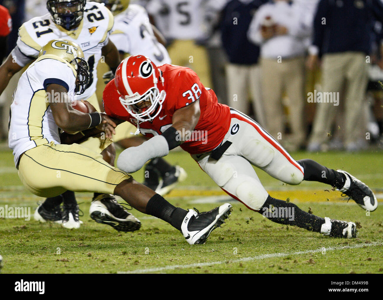 Georgia Tech quarterback Josh Nesbitt (9) is tackled by Georgia ...