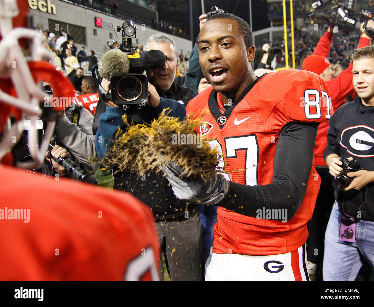 Georgia wide receiver Vernon Spellman (87) holds a piece of Georgia ...