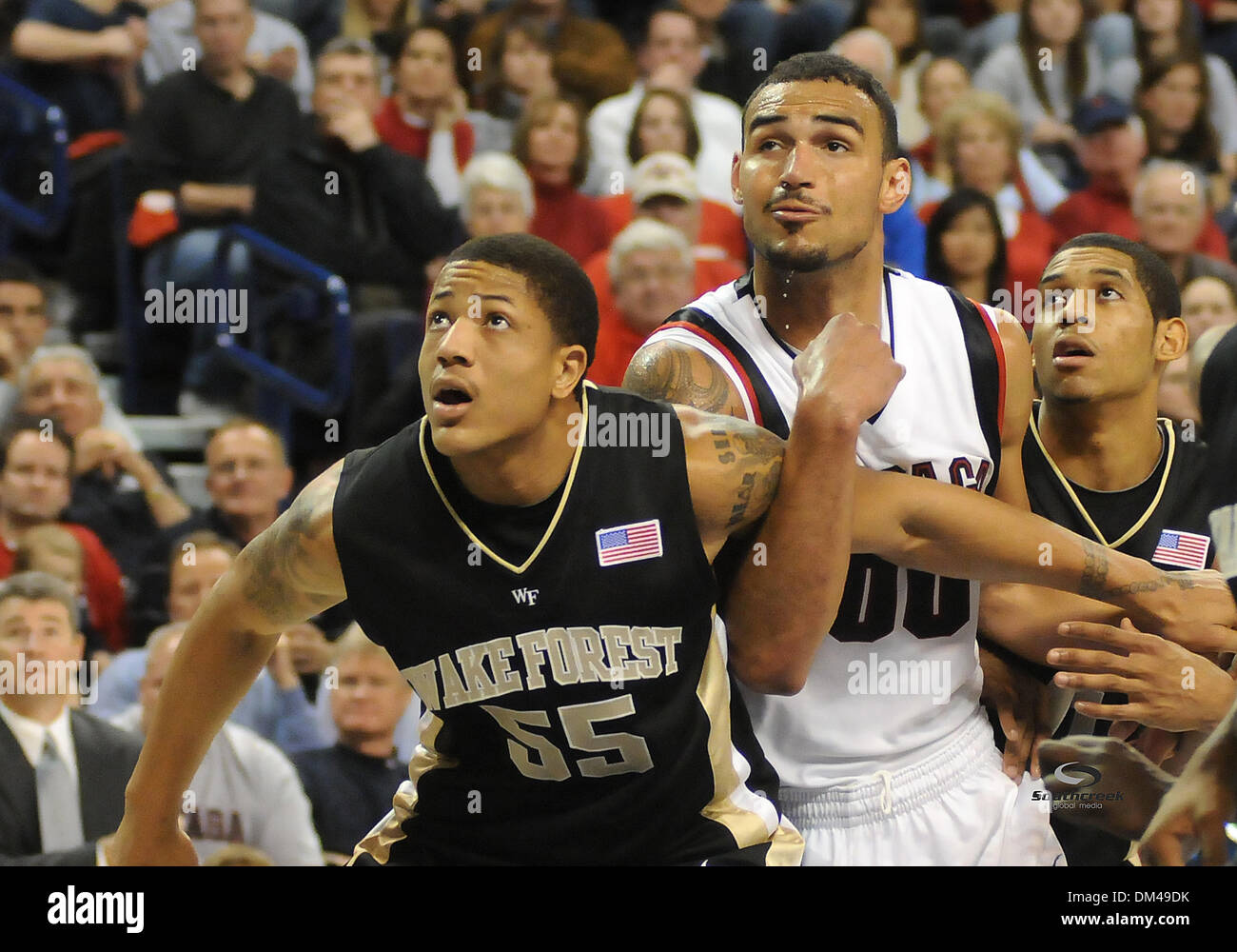 Gonzaga's Robert Sacre, right, fights for position with Wake Forest's ...