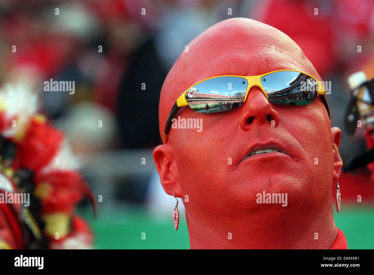 A Chiefs fan watches the NFL football game between the Kansas City ...