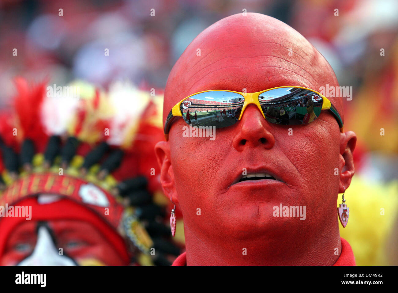 A Kansas City Chiefs fan watches the NFL football game between the ...