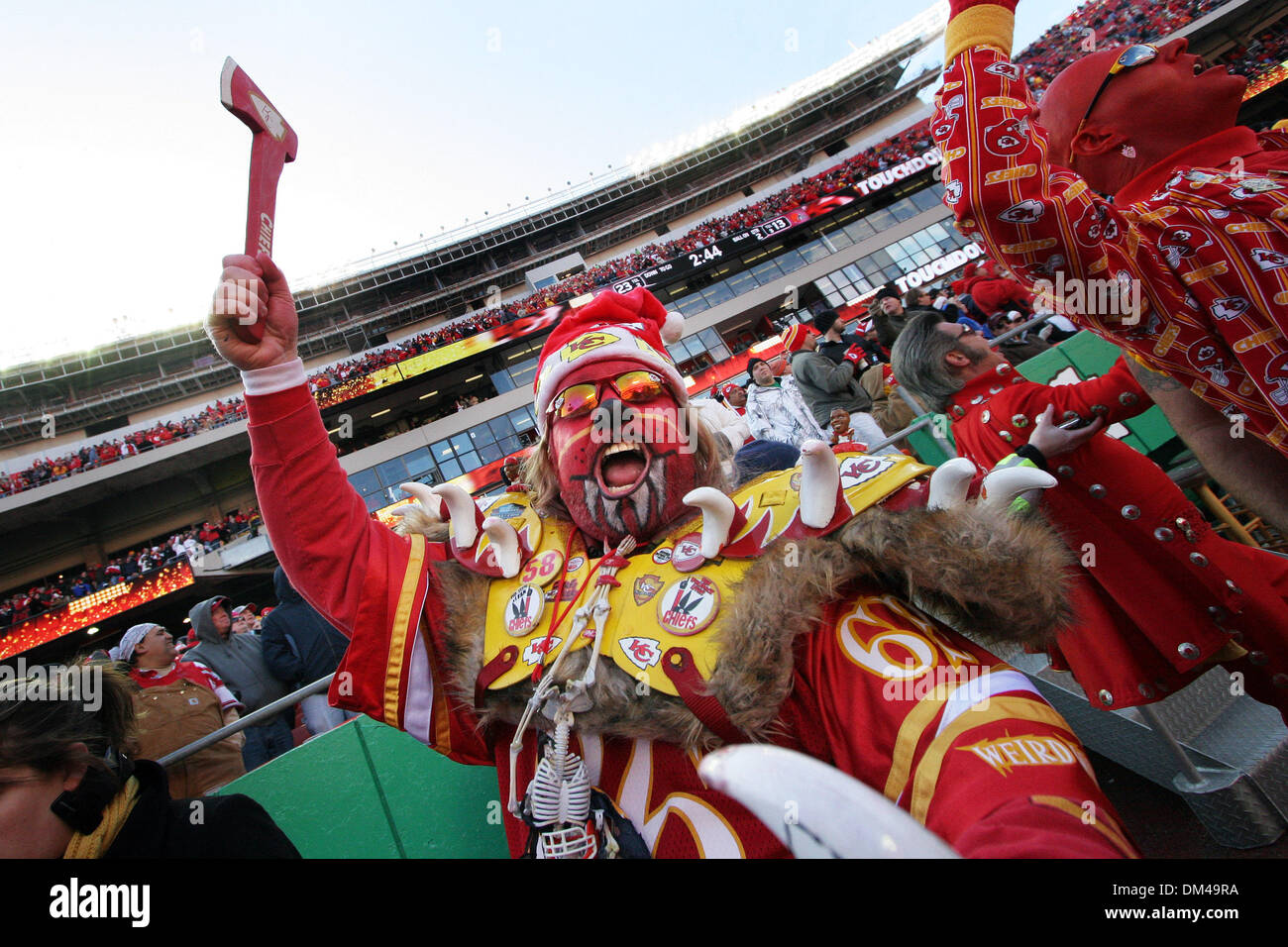 A chiefs fan cheers during the NFL football game between the Kansas ...