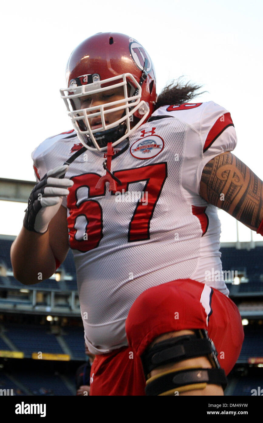 Utah offensive lineman Derek Tuimauga #67 warms up on the sideline ...