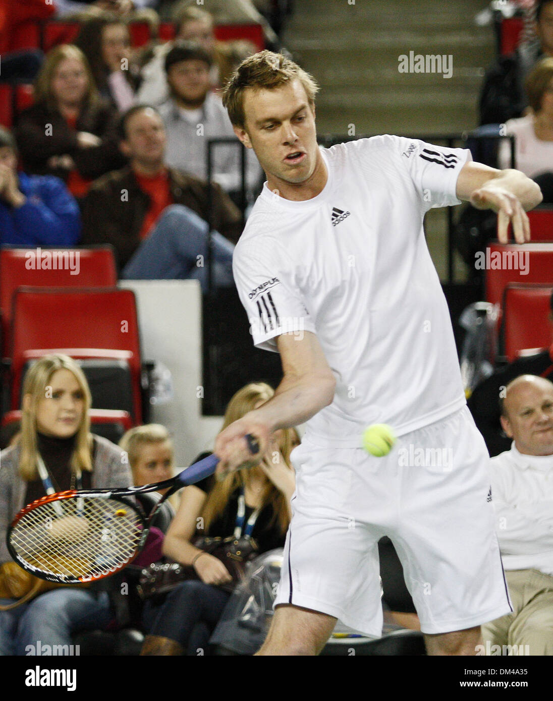 Sam Querry returns the ball at Rock n' Racquets in Stegeman Coliseum at ...