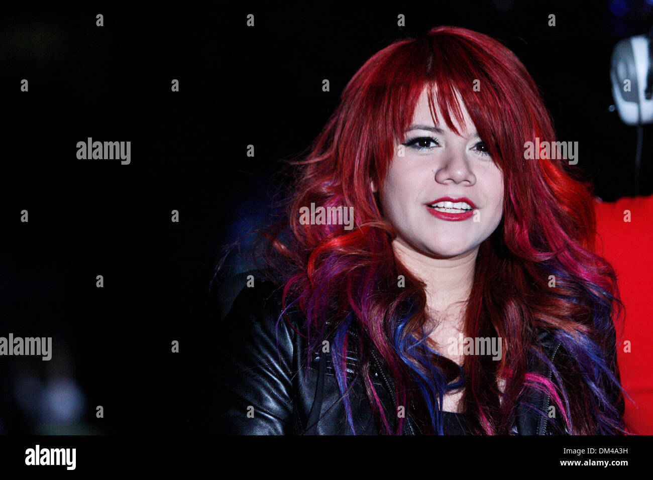 Singer Allison Iraheta walks in under spot light at Rock n' Racquets in ...